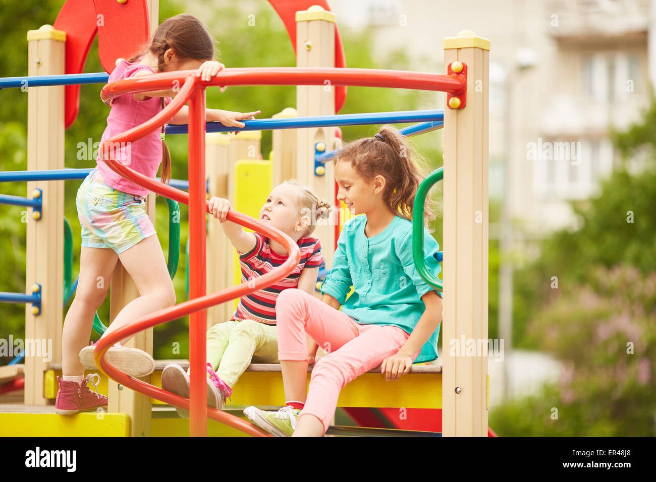Friendly girls spending weekend on playground Stock Photo - Alamy