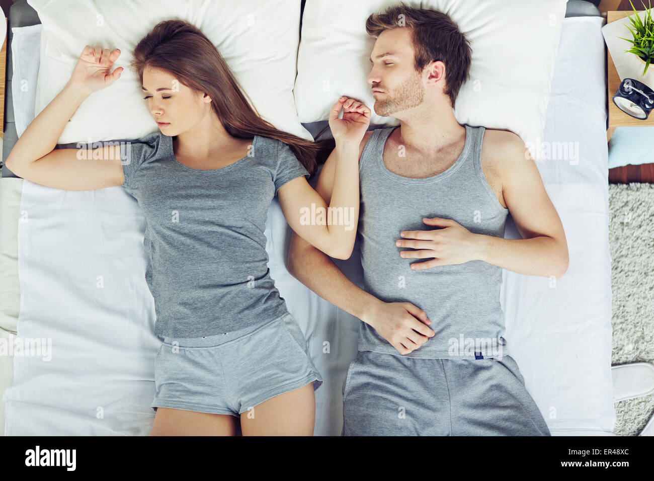 Young couple sleeping at night Stock Photo - Alamy