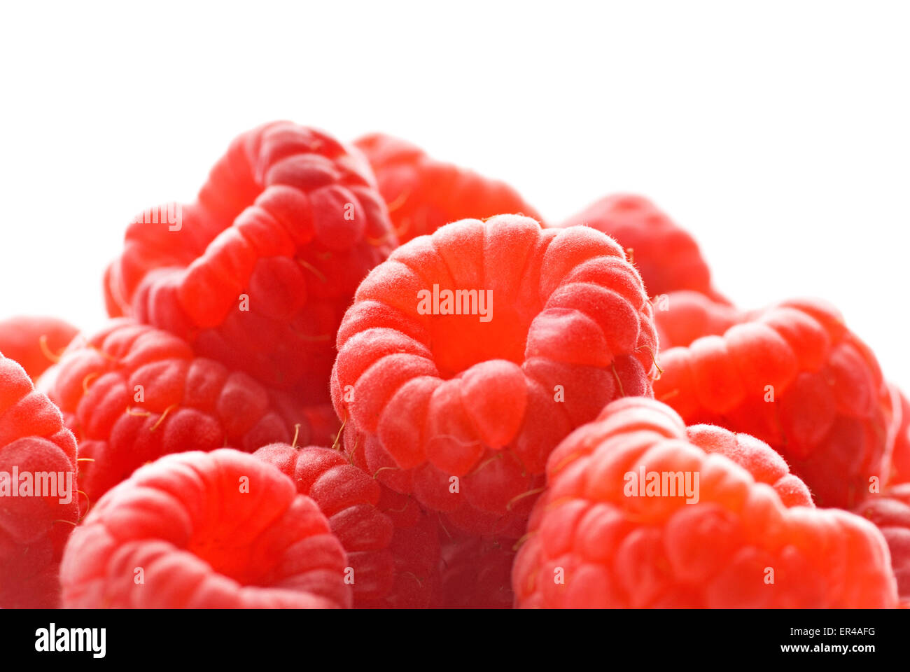 Ripe raspberries isolated on white background Stock Photo - Alamy