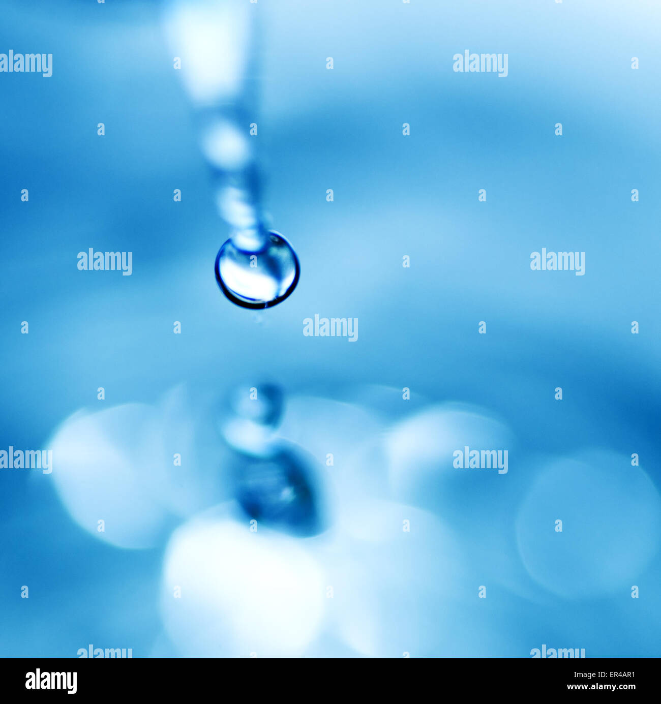Falling water drop (shallow DoF Stock Photo - Alamy