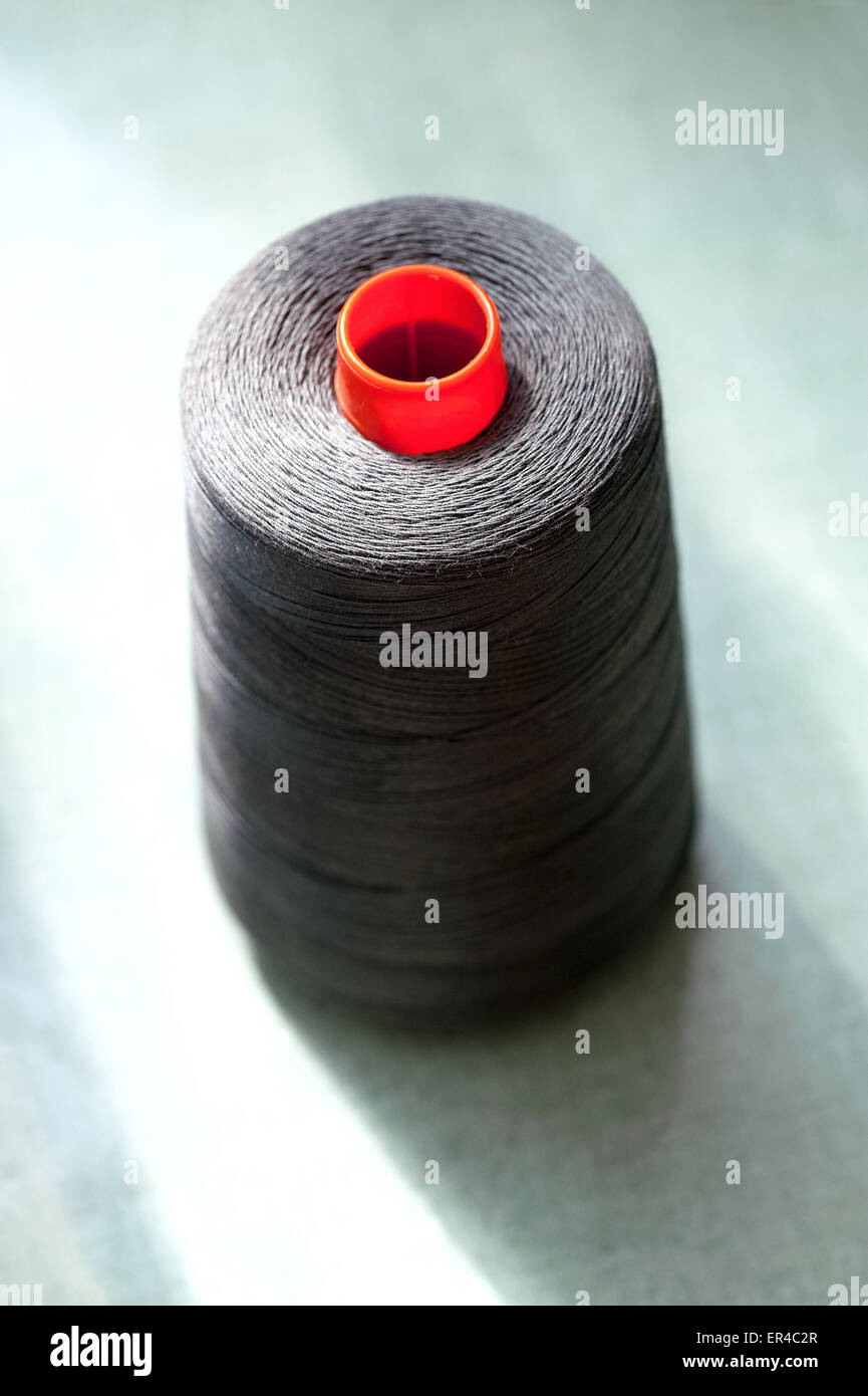 High Angle View of Industrial Spool of Black Thread on Table in ...