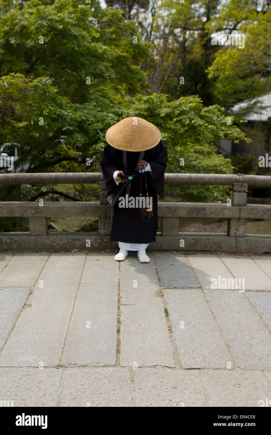 Japanese Buddhist monk collecting donations in Nara, Japan Stock Photo ...