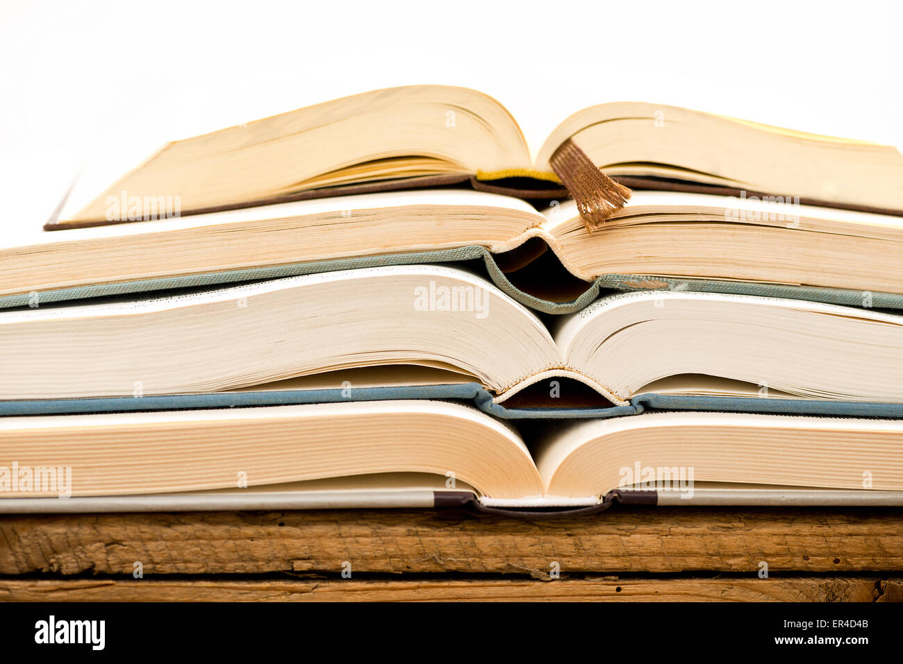 mound of open books on the white background Stock Photo - Alamy
