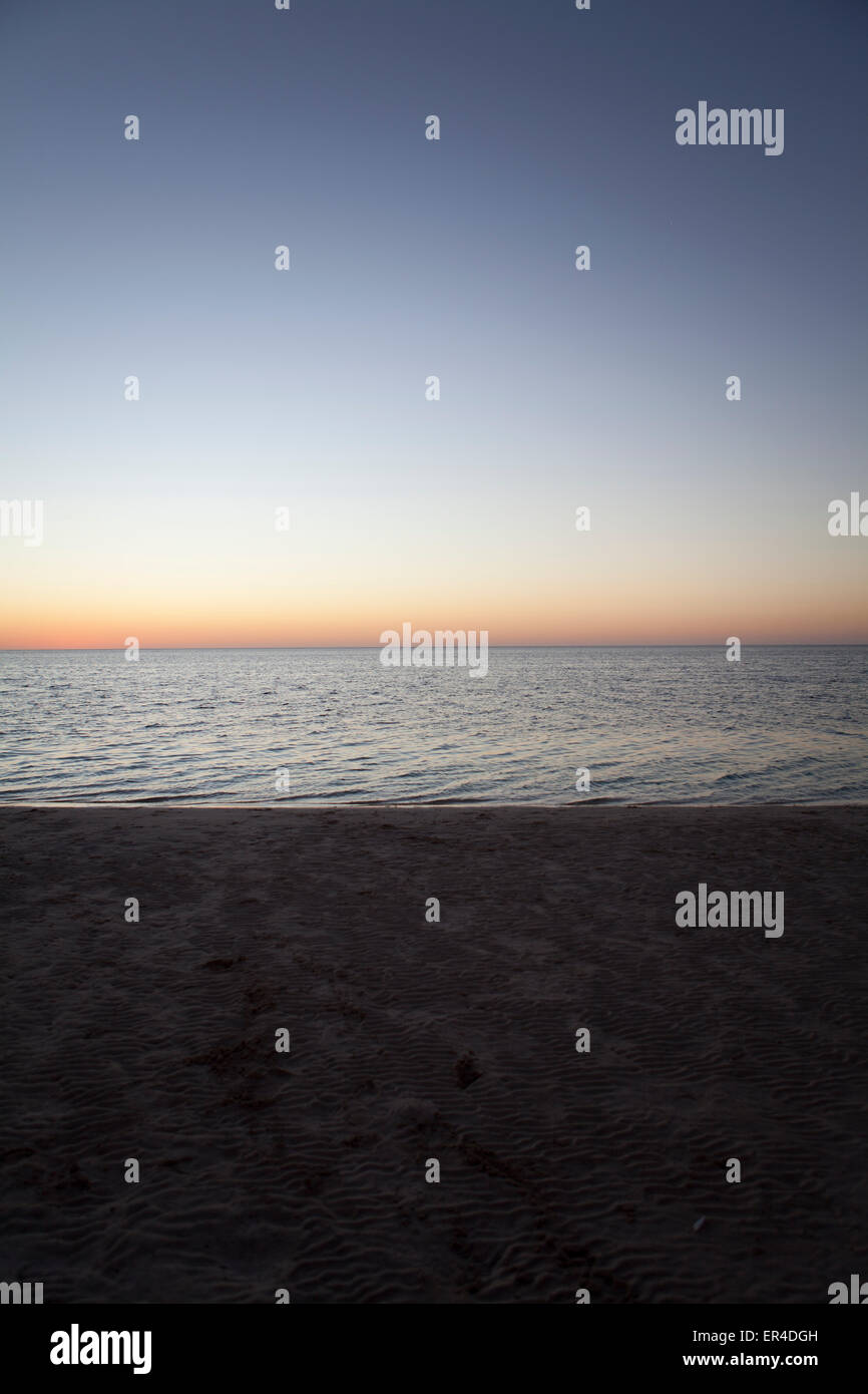 Sunset on the beach at Coral Bay in Western Australia Stock Photo - Alamy
