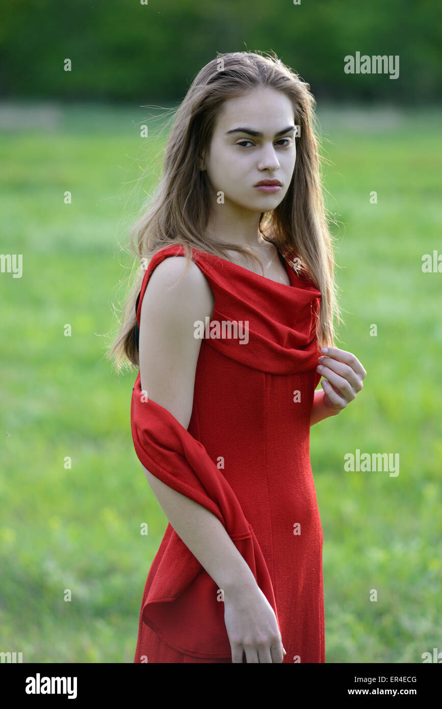 strong beauty, woman in red Stock Photo - Alamy