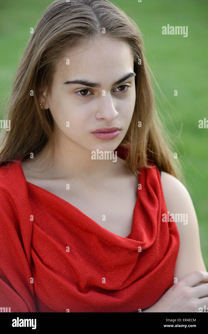 strong beauty, woman in red Stock Photo - Alamy