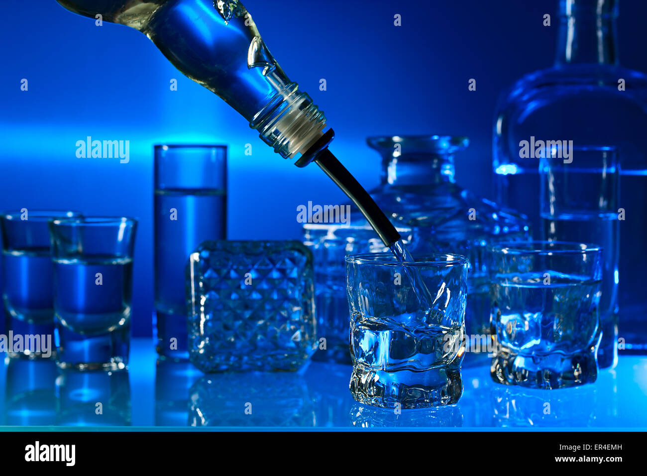 vodka in bar on a glass table Stock Photo - Alamy