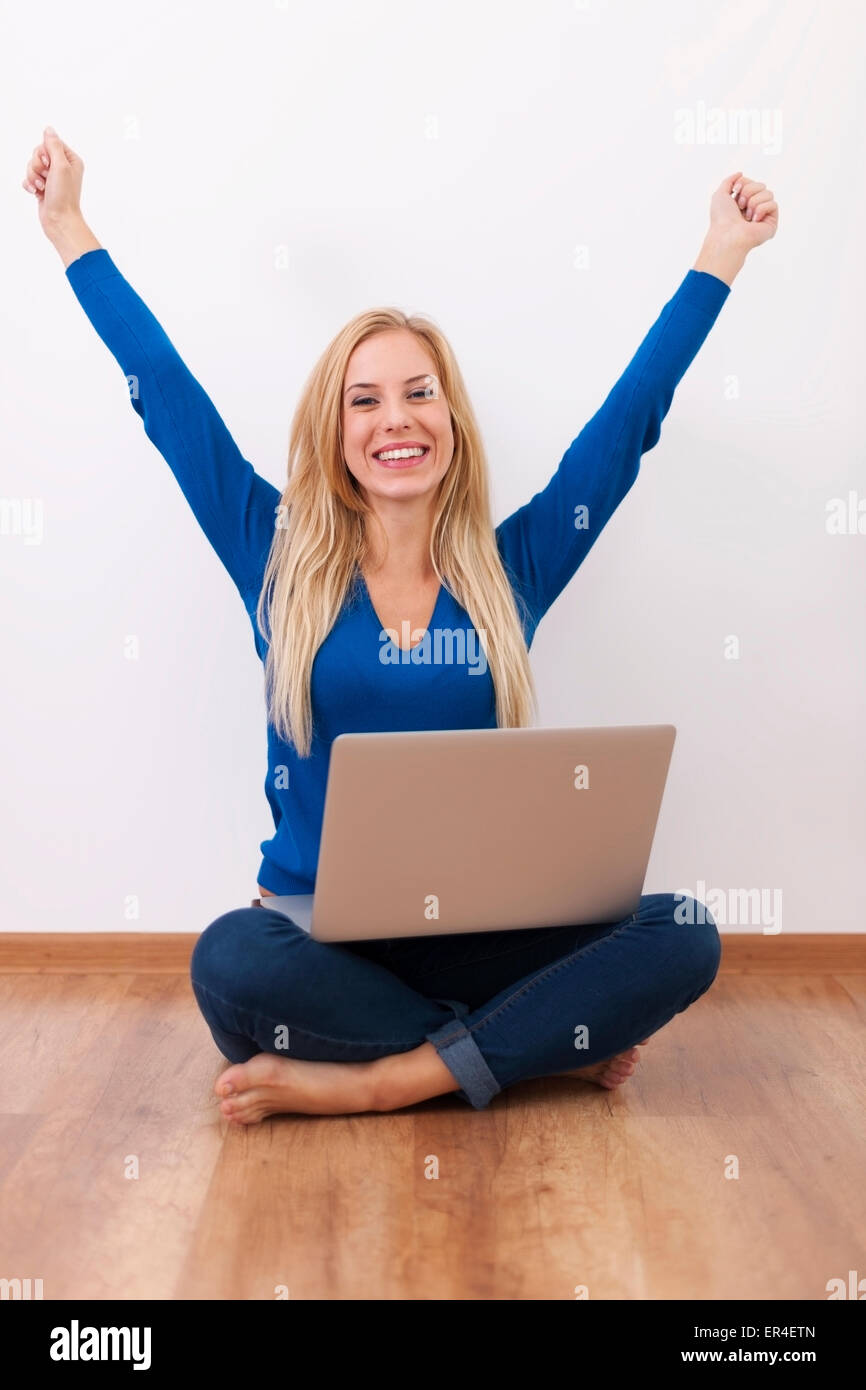 Excited woman sitting laptop hi-res stock photography and images - Alamy