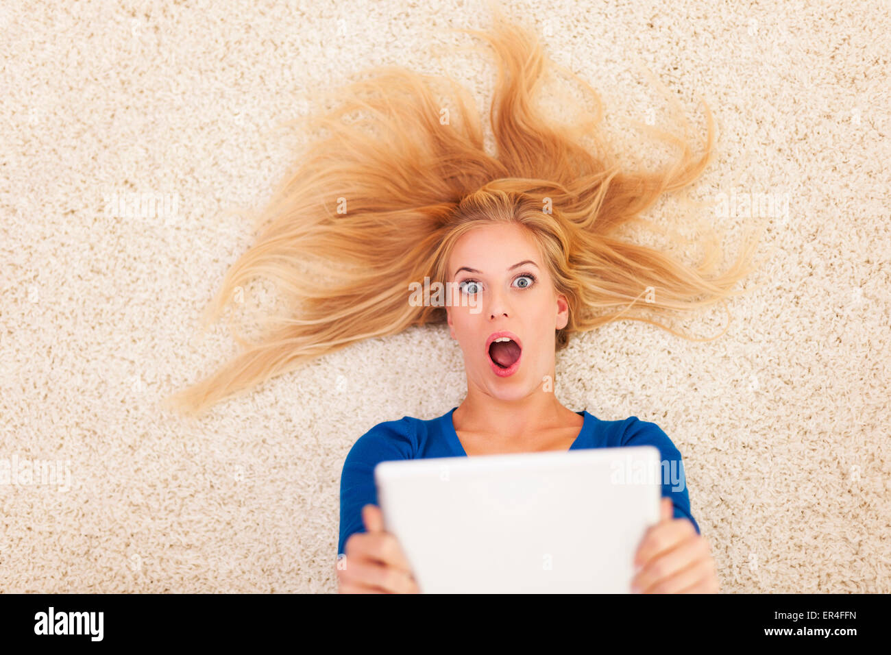 Woman shocked looking down hi-res stock photography and images - Alamy