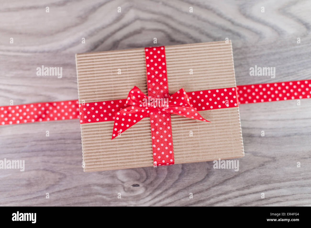 Neatly wrapped present on a table Stock Photo - Alamy