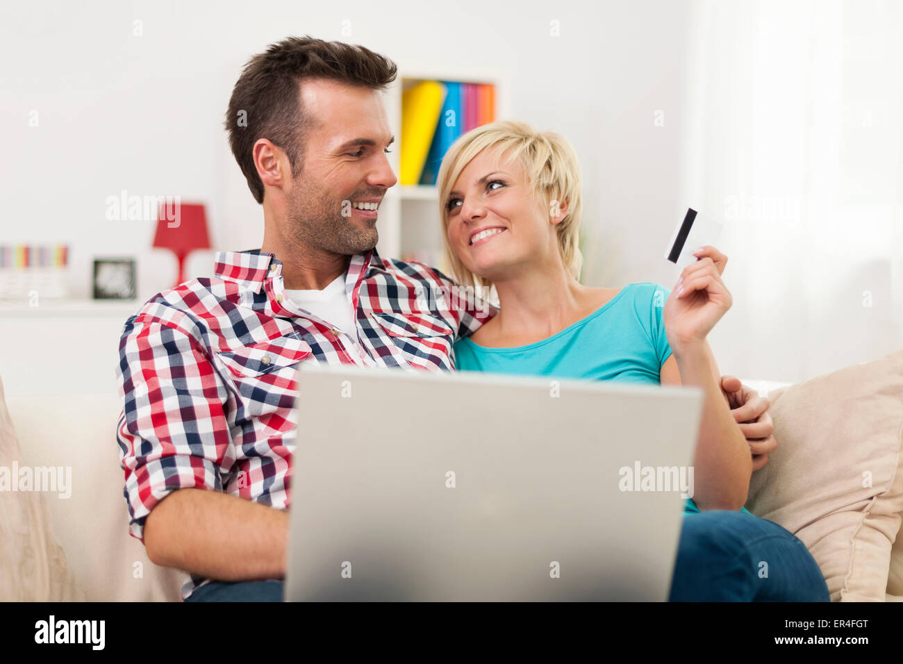 Couple shopping online together Stock Photo - Alamy