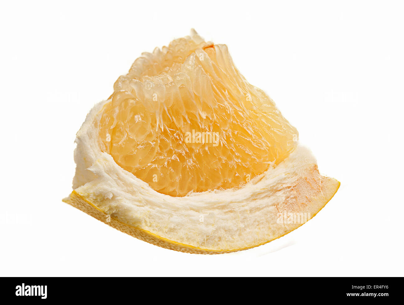 Pomelo citrus fruit slice closeup isolated on white Stock Photo - Alamy