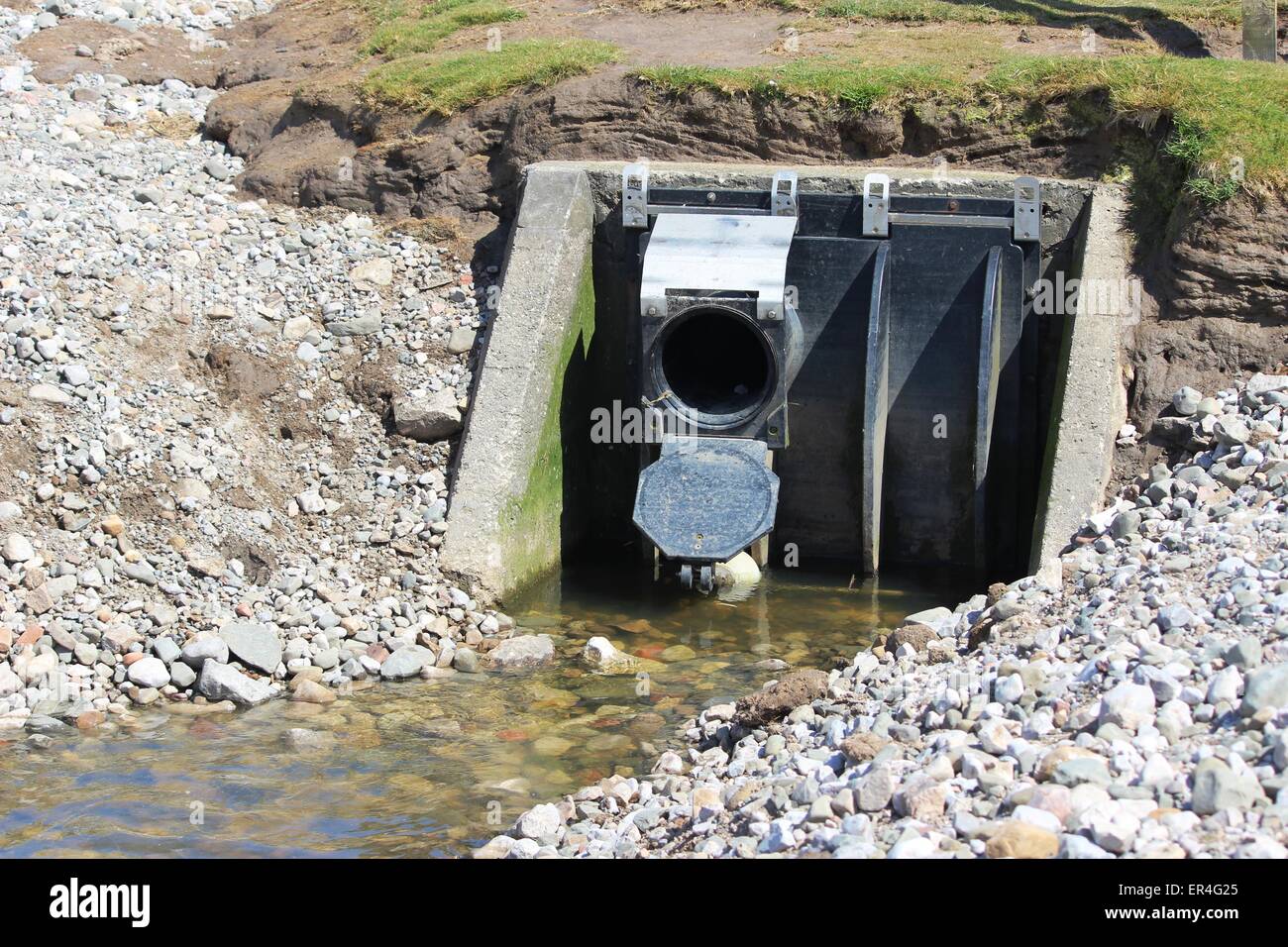 View of Red Bank Tidal Flap on the shore of Morecambe Bay near Bolton ...