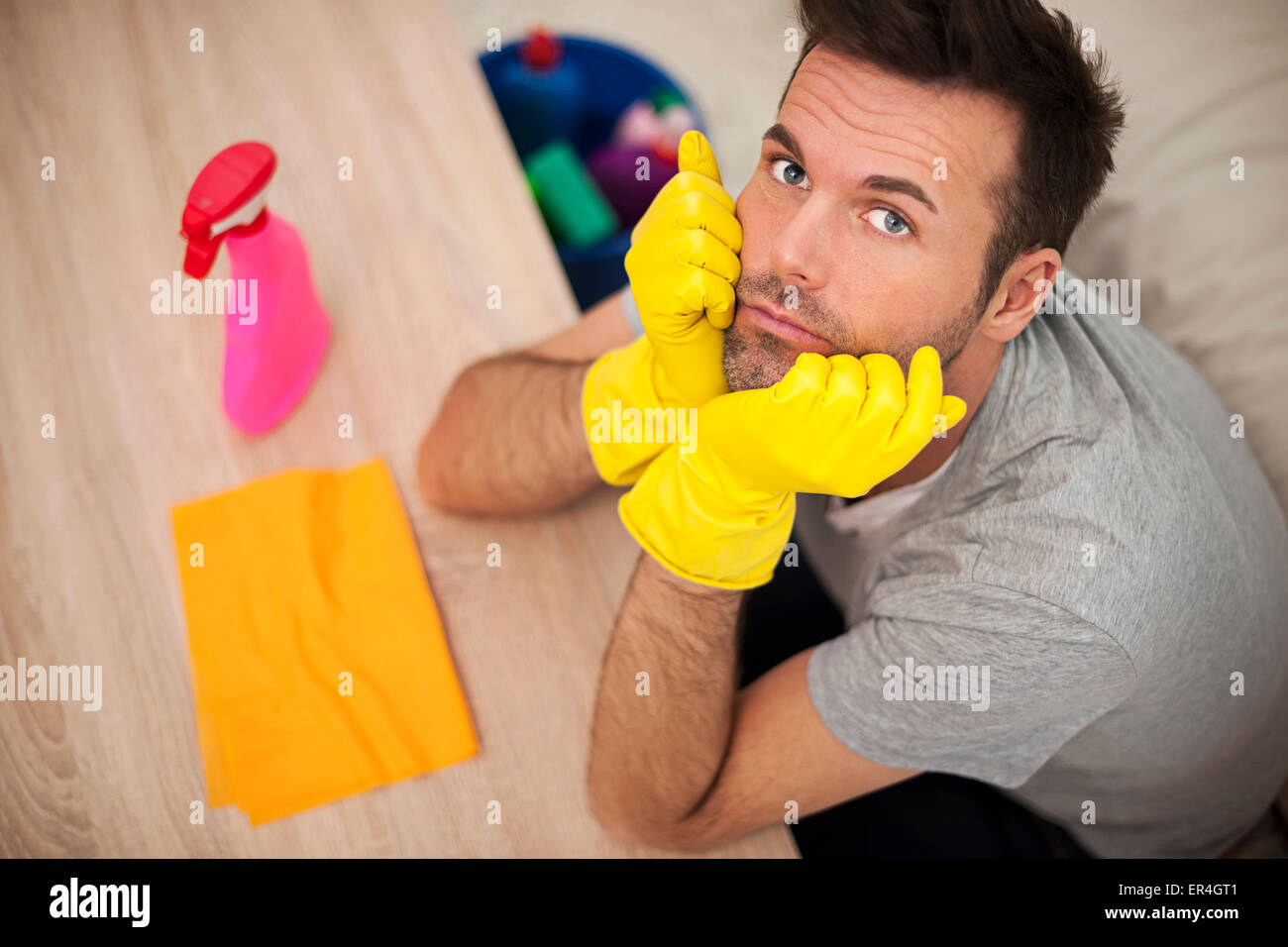 Man cleaning up the living room Stock Photo - Alamy
