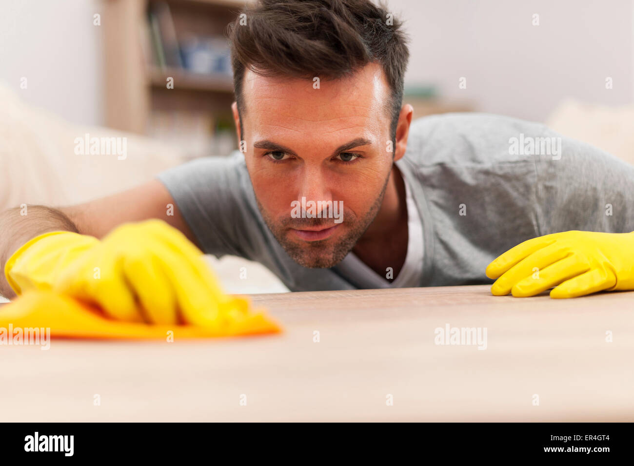 Man cleaning his table Stock Photo - Alamy