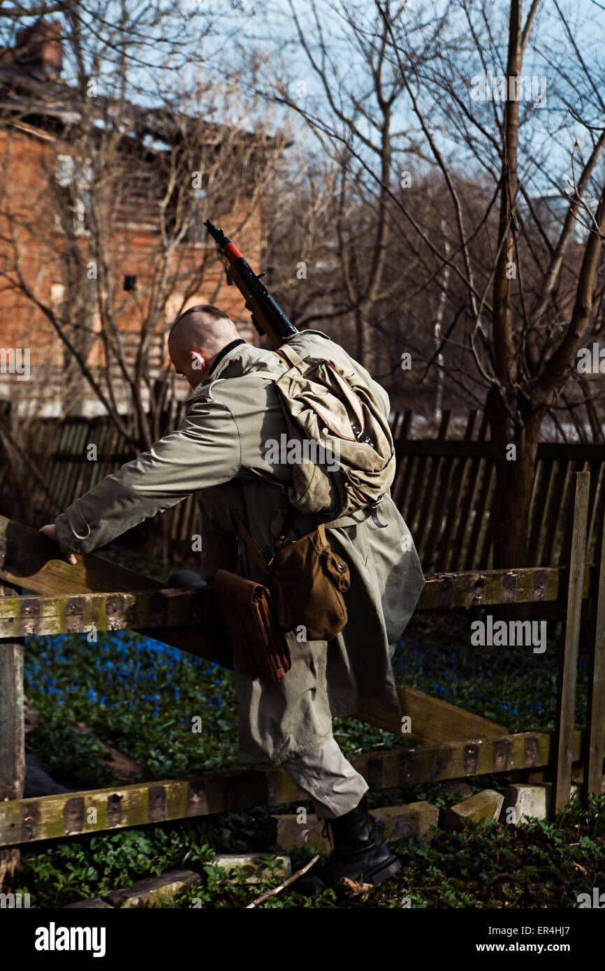 A shaved hunter stepps over the fence Stock Photo - Alamy
