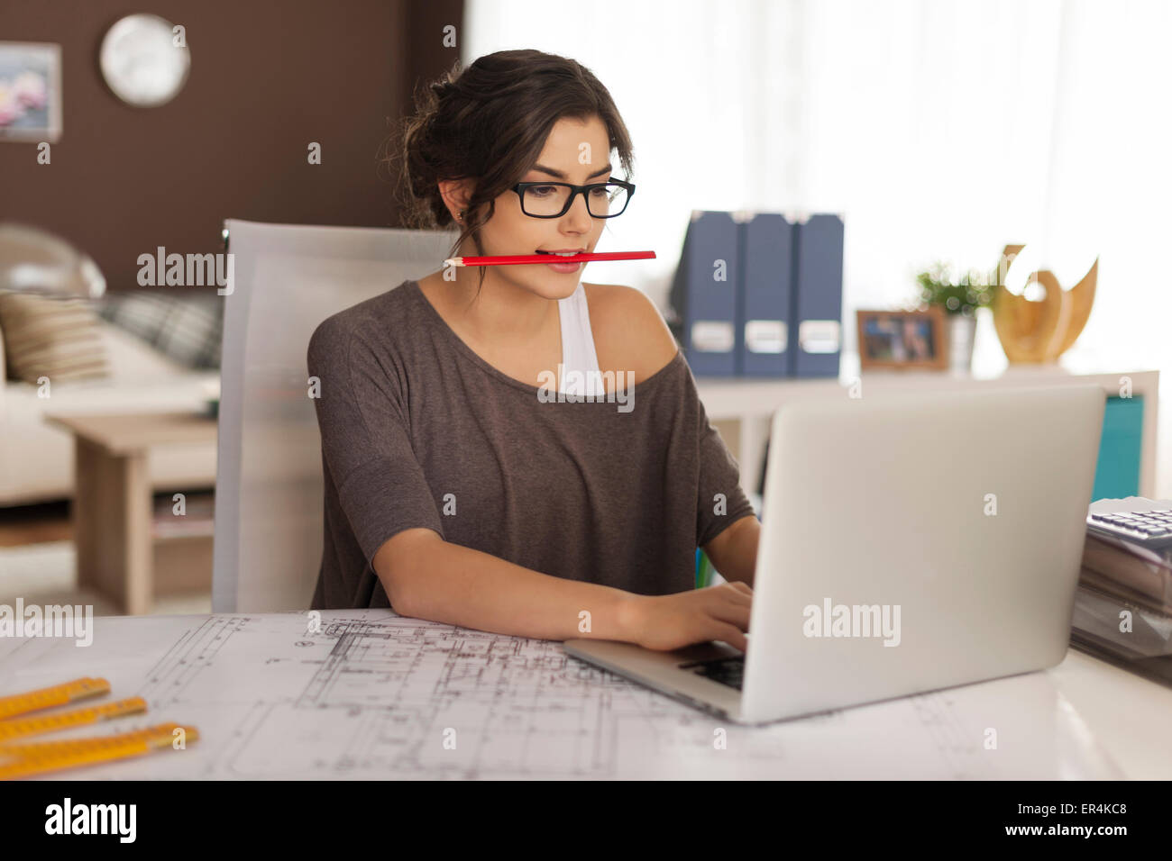 Very busy young architect working at home. Debica, Poland Stock Photo ...