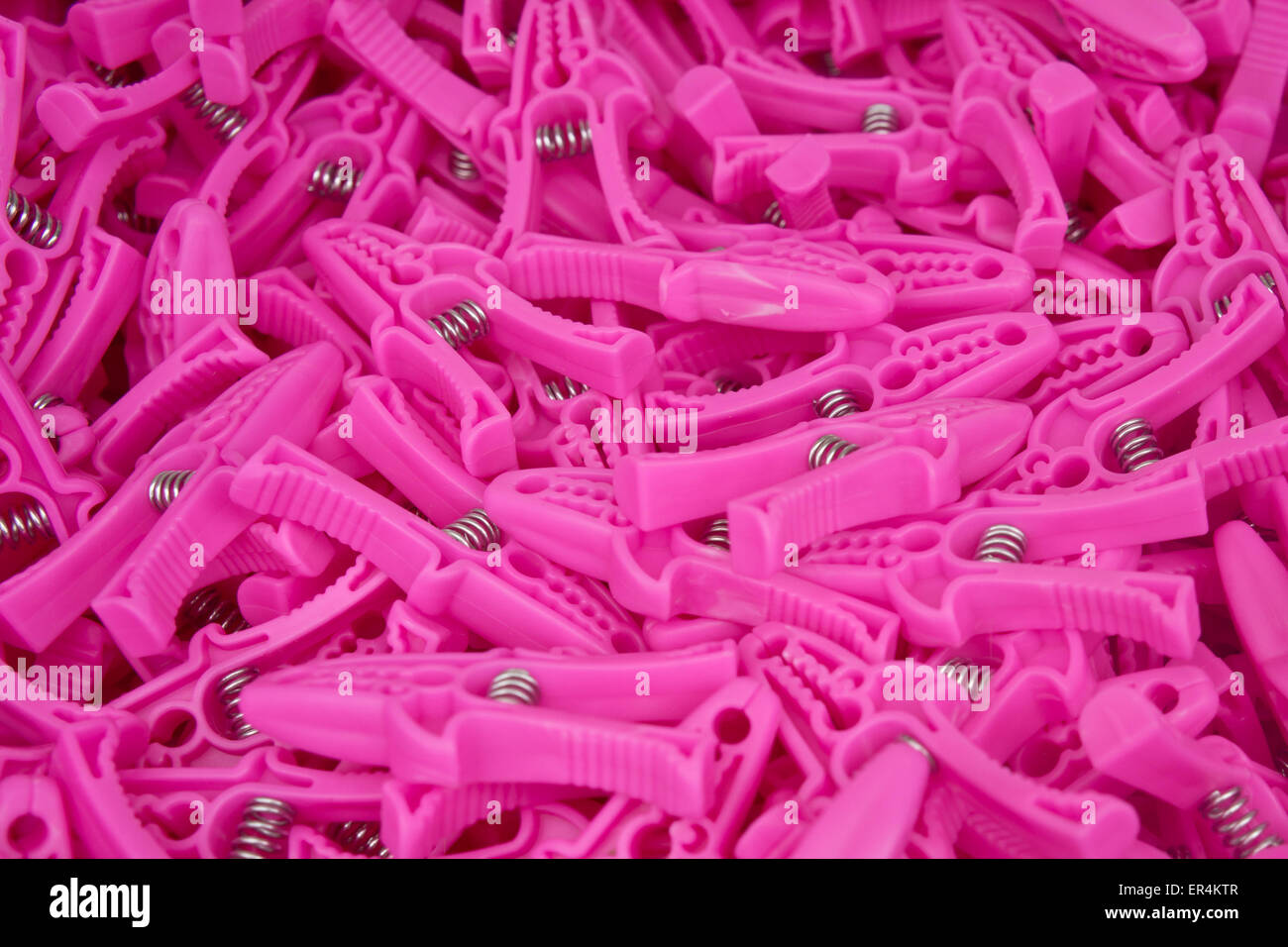 background of pink plastic clothespin Stock Photo - Alamy
