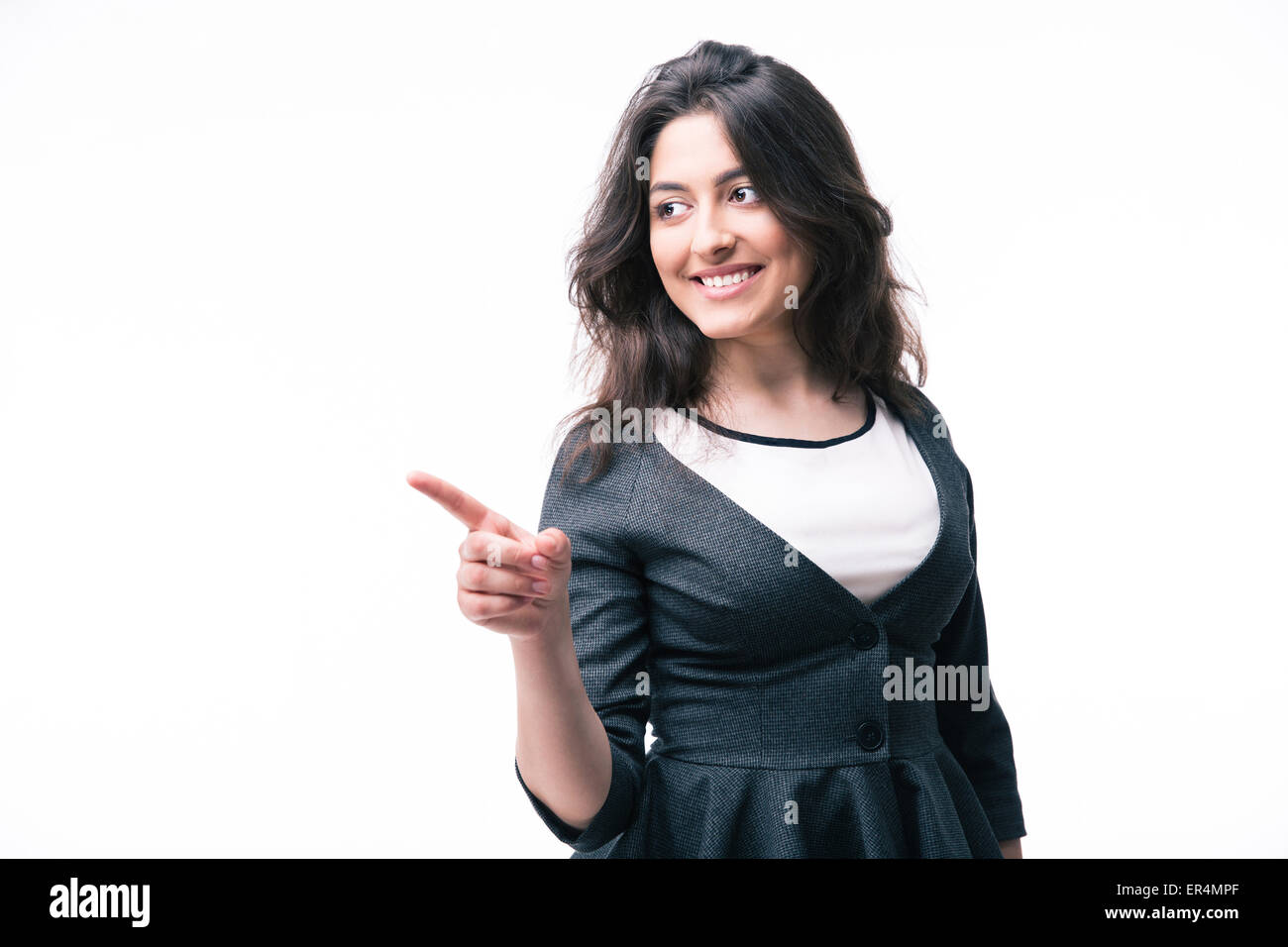 Happy businesswoman pointing finger away isolated on a white background ...