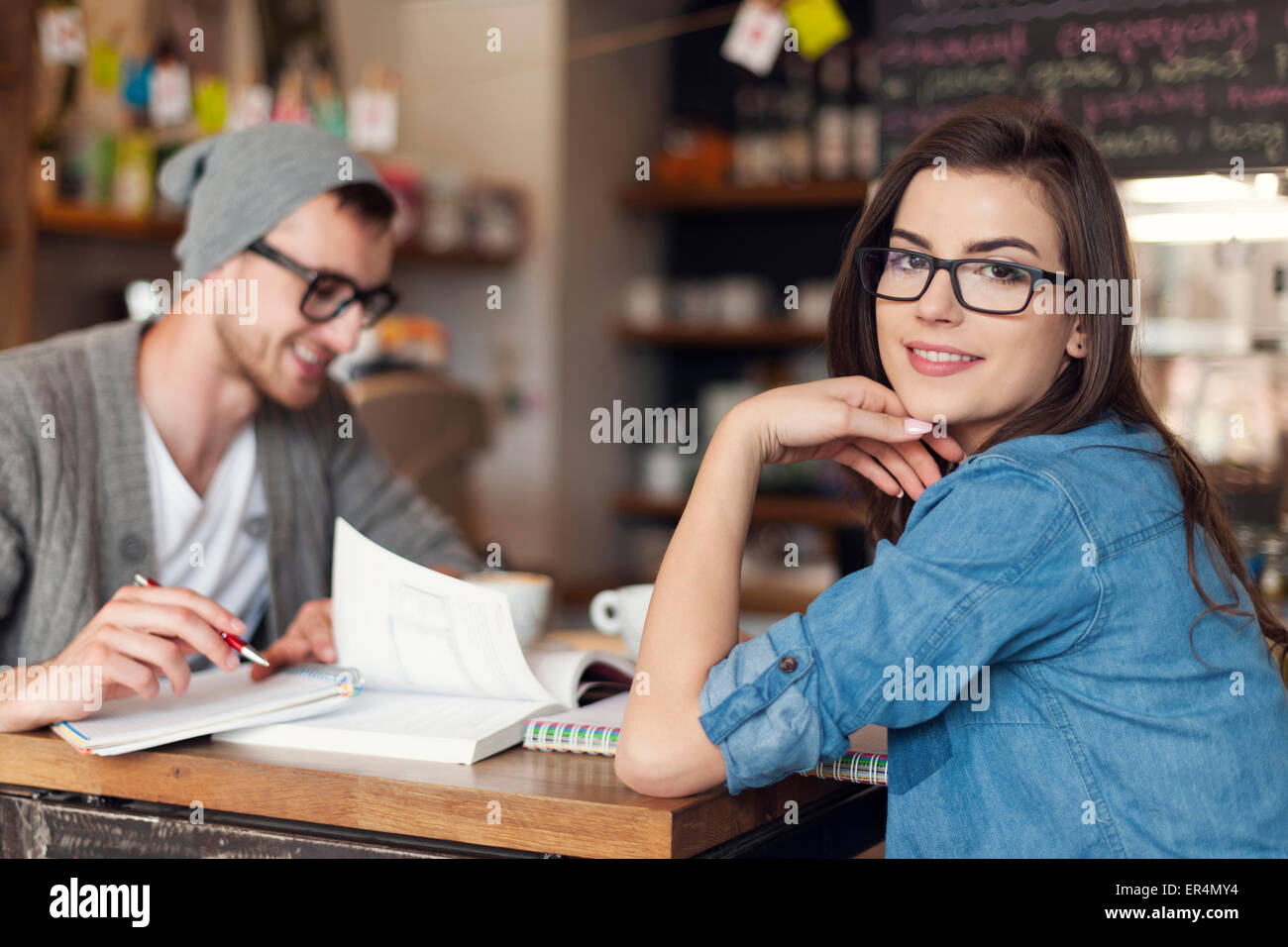 Stylish woman studying with her friend at cafe. Krakow, Poland Stock ...