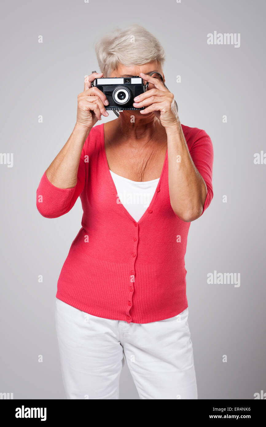 Older lady with a camera Stock Photo - Alamy