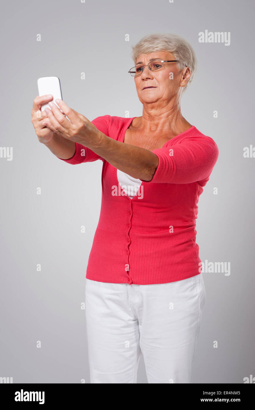 Older lady with a cellphone Stock Photo - Alamy