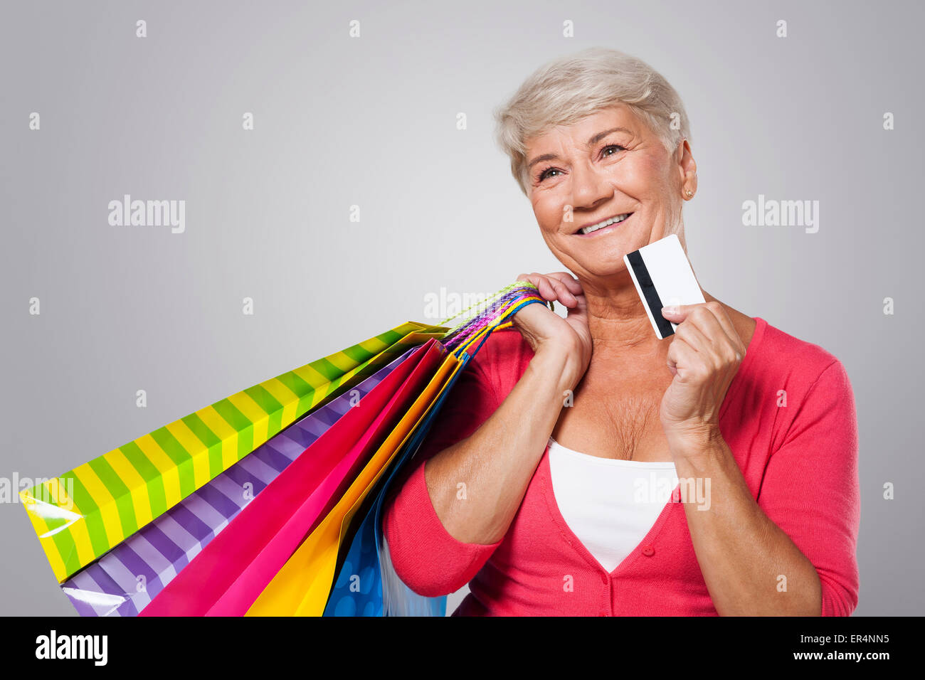 Lady happy to be shopping Stock Photo - Alamy