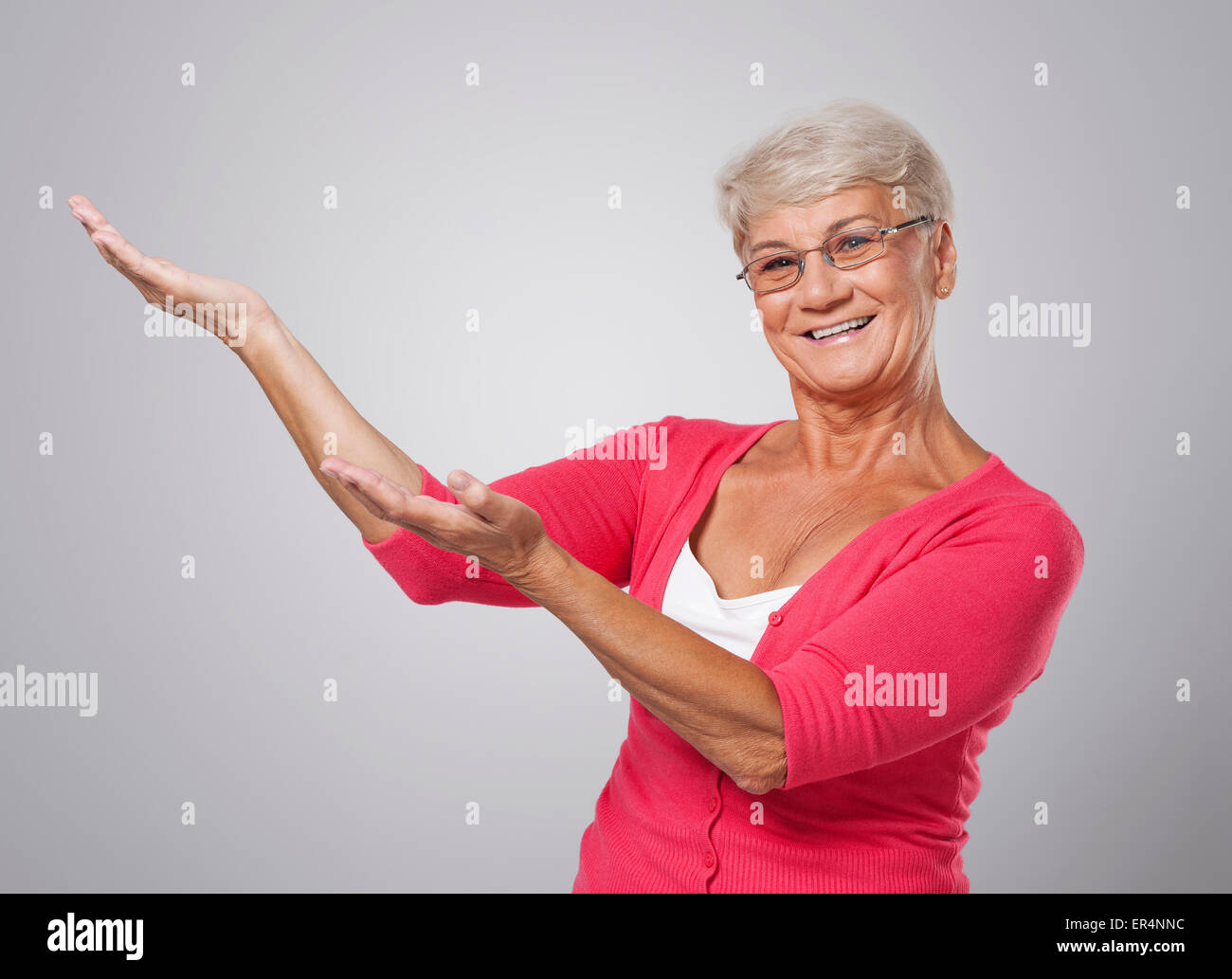Lady pointing to caption Stock Photo - Alamy