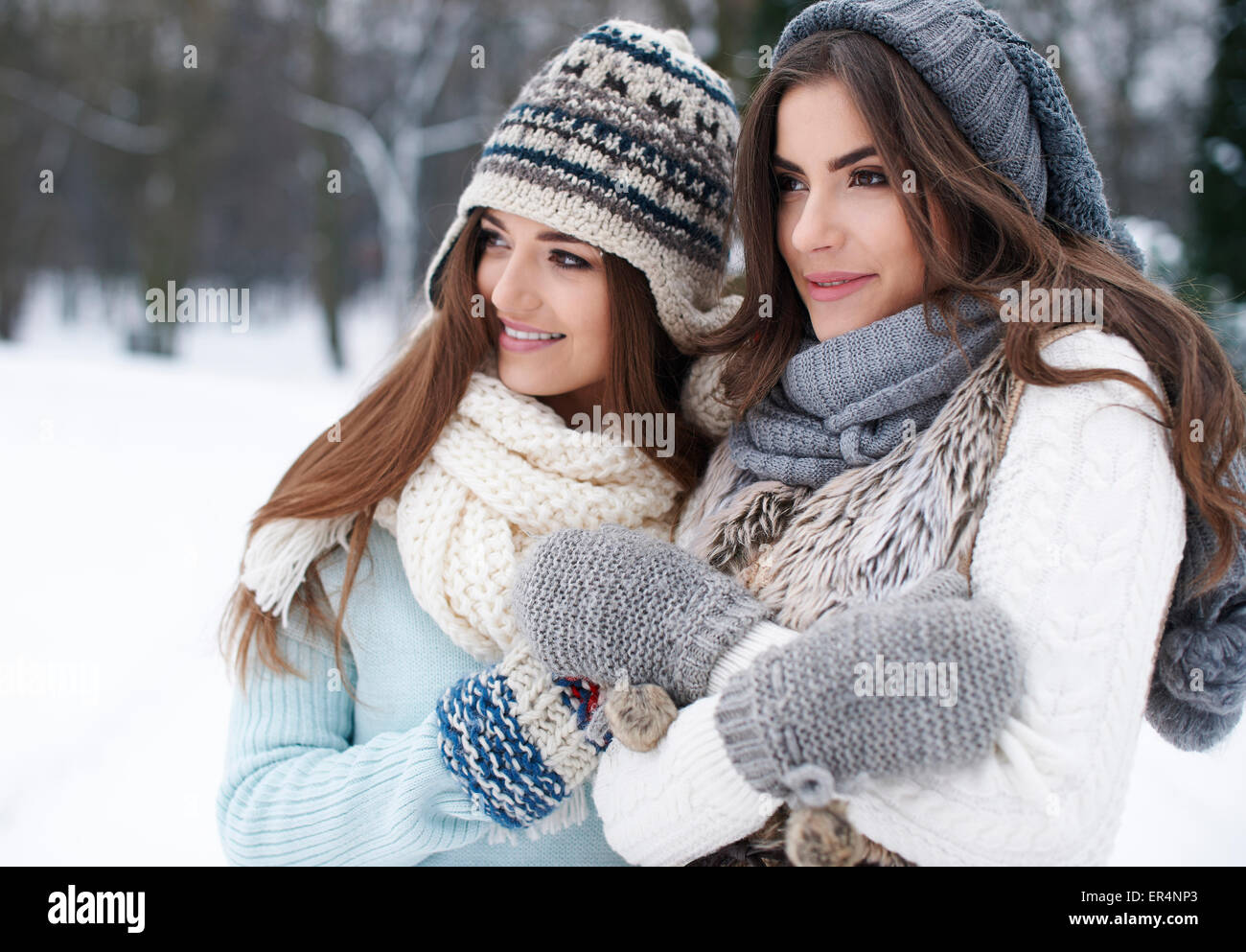 Warmed by friendship in winter. Debica, Poland Stock Photo - Alamy