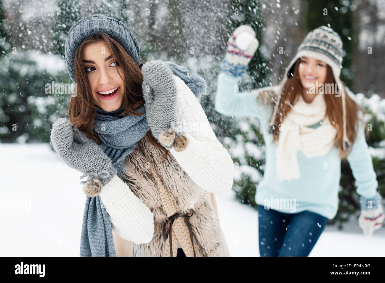 Young women have fun during the snowball fight. Debica, Poland Stock ...