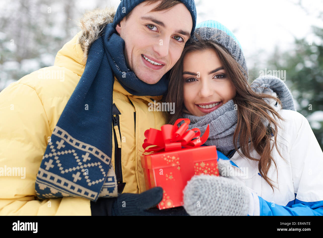 Giving presents snow hi-res stock photography and images - Alamy