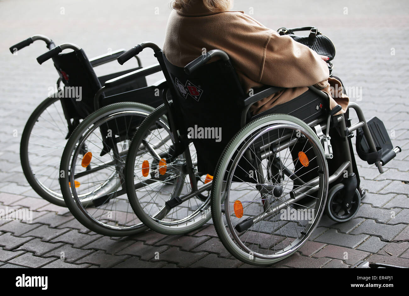 Cologne, Germany. 27th May, 2015. A senior citizen sits in a wheelchair ...