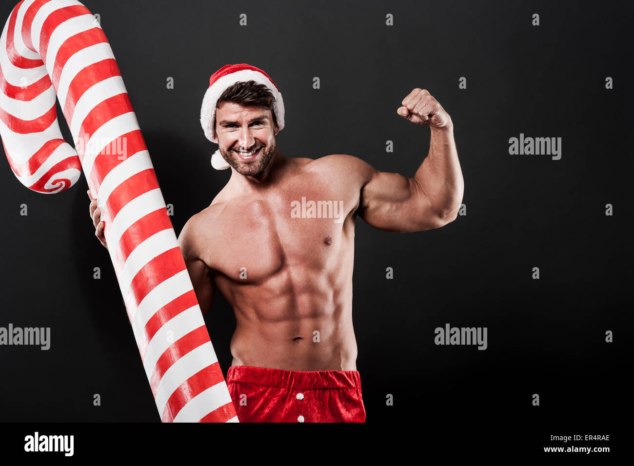 Masculine santa claus with christmas candy cane. Debica, Poland Stock ...