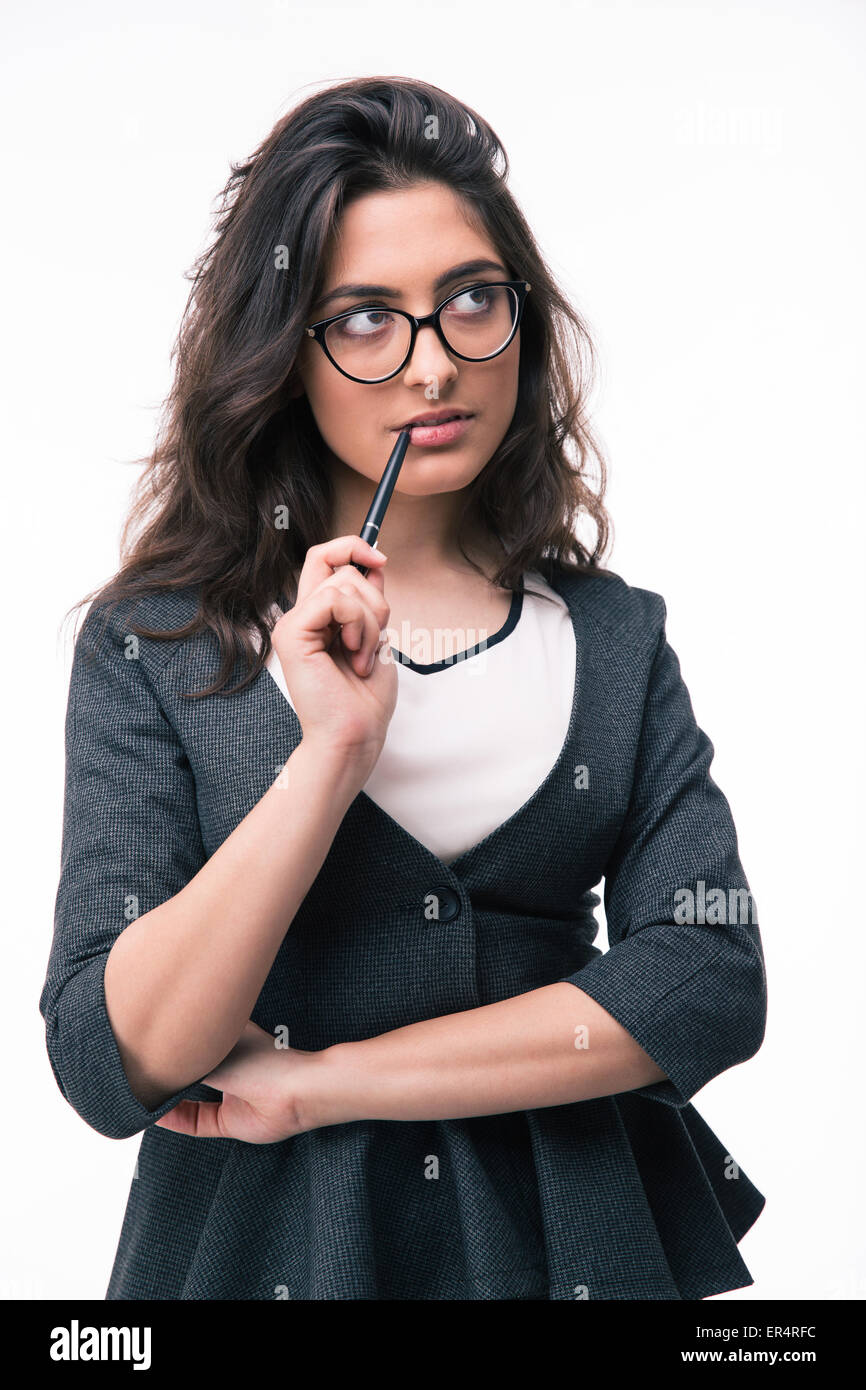 Portrait of a pensive businesswoman with pen isolated on a white ...