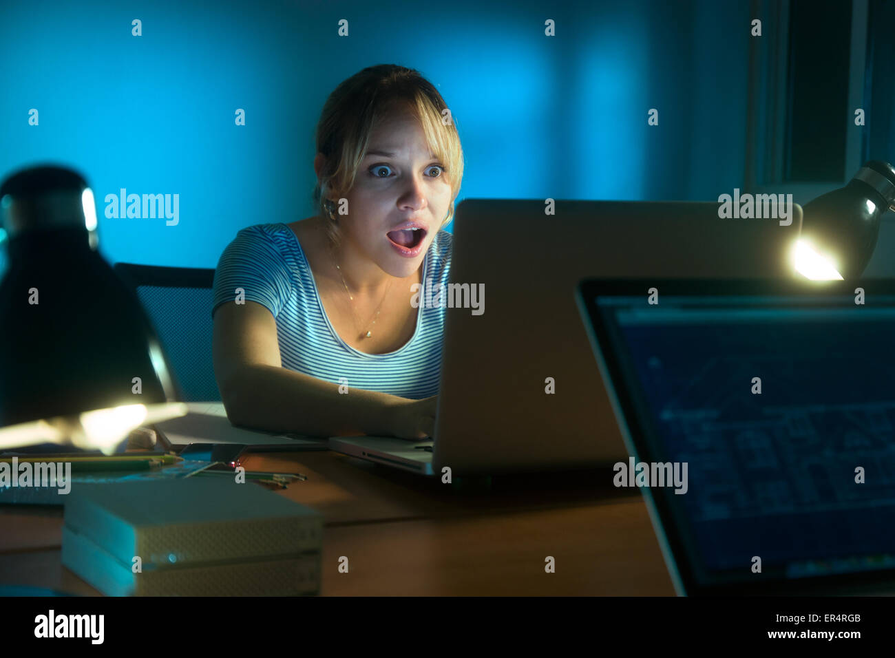 Shocked surprise woman looking computer hi-res stock photography and ...