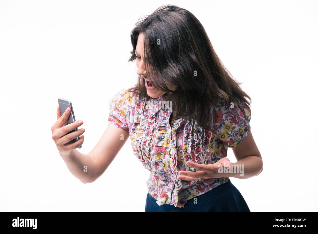Woman shouting on smartphone isolated on a white background Stock Photo ...