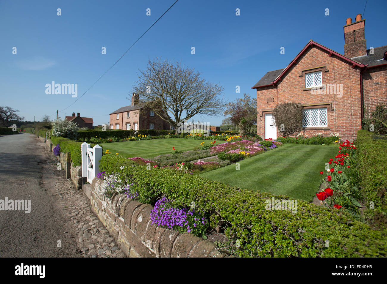 Village of Aldford, England. Picturesque spring view of an Eaton Estate ...