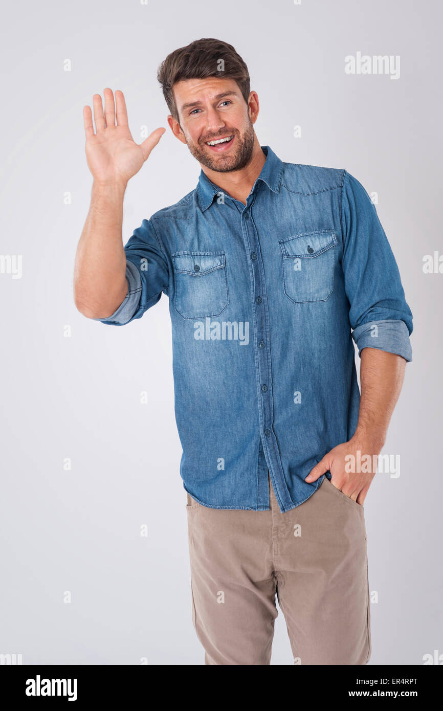 Waving standing smiling looking away hi-res stock photography and ...