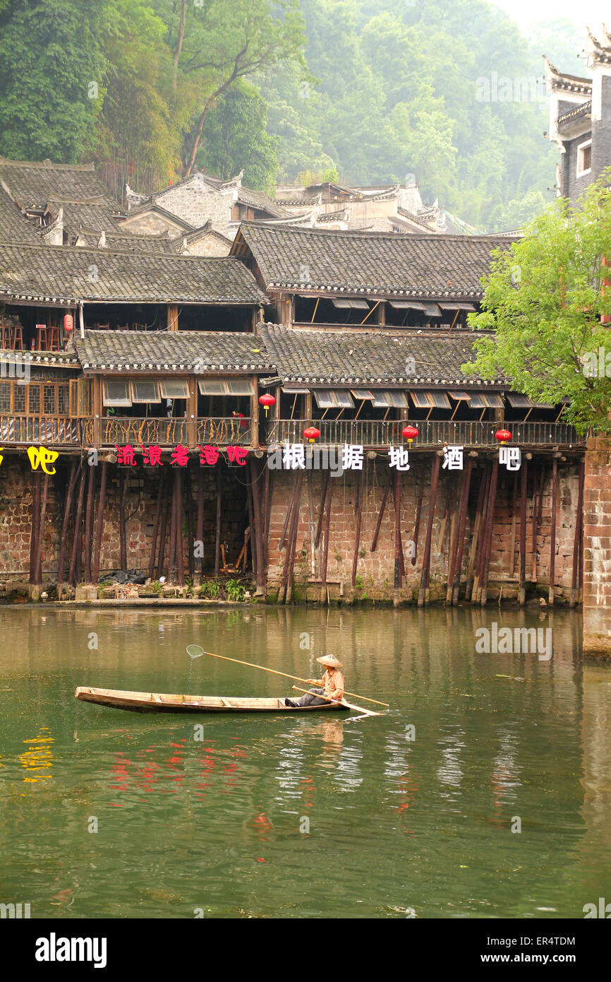 FENGHUANG - MAY 12: Wooden boat and wooden houses at tuojiang river in ...