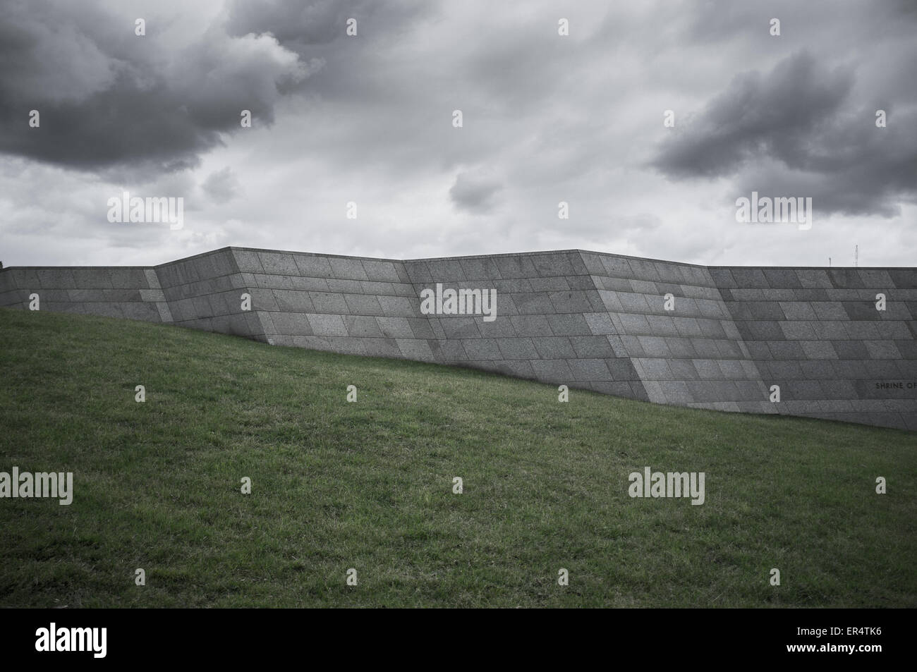 High stone wall on a green hill Stock Photo - Alamy
