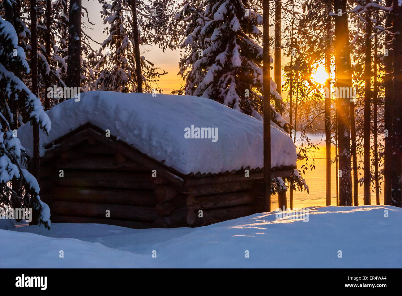 Wooden barn in beautiful winter sunset Stock Photo - Alamy