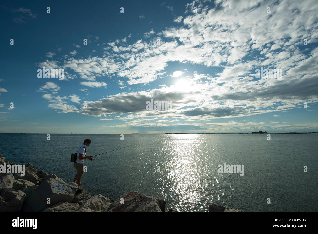 the fishermen fishing on the sea Stock Photo - Alamy