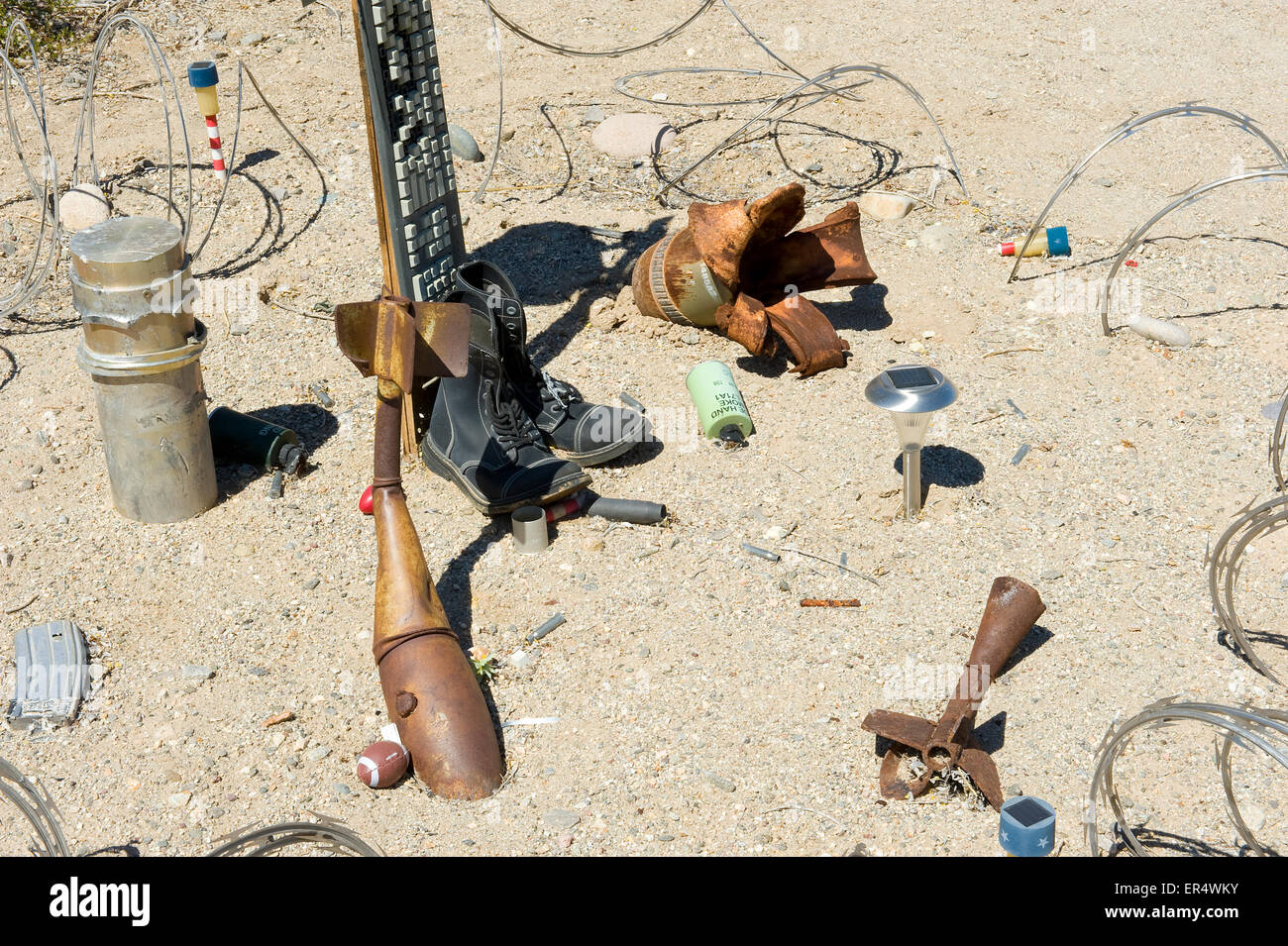 Art installation of bombs, boots, razor wire etc, East Jesus, Slab City ...
