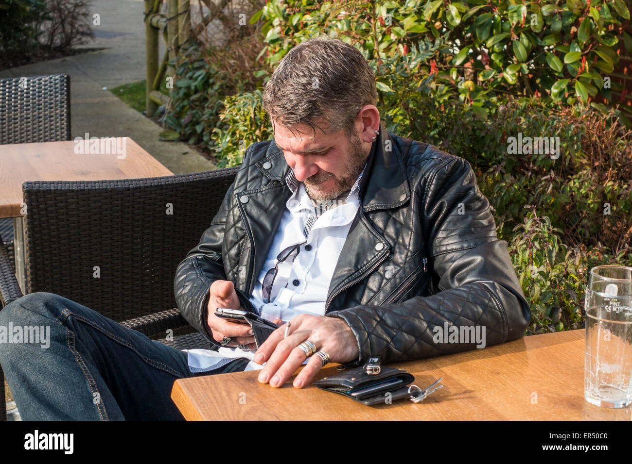 Young man using mobile phone Stock Photo - Alamy
