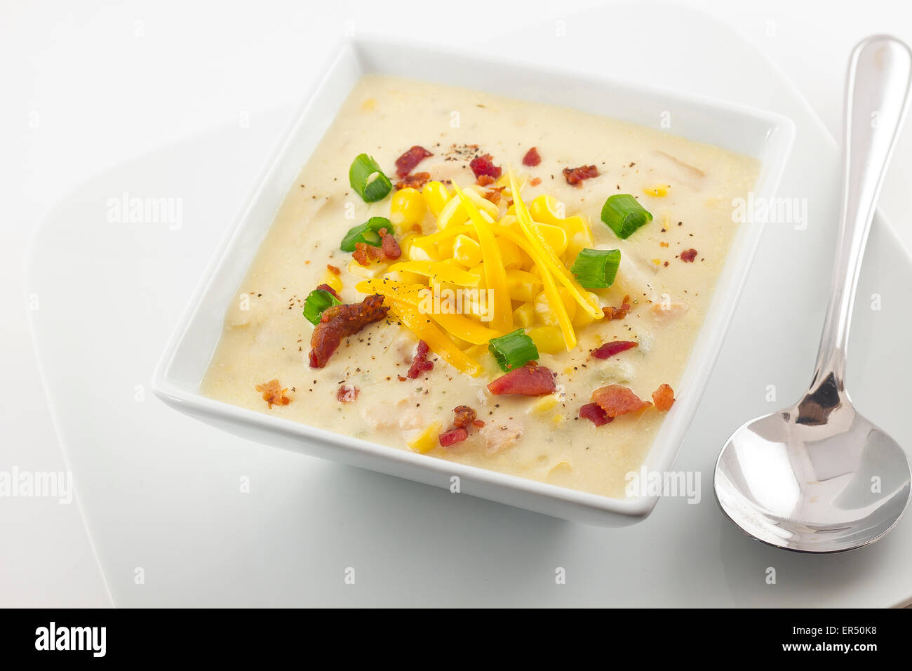 Corn chowder with scallions bacon and grated cheddar Stock Photo - Alamy