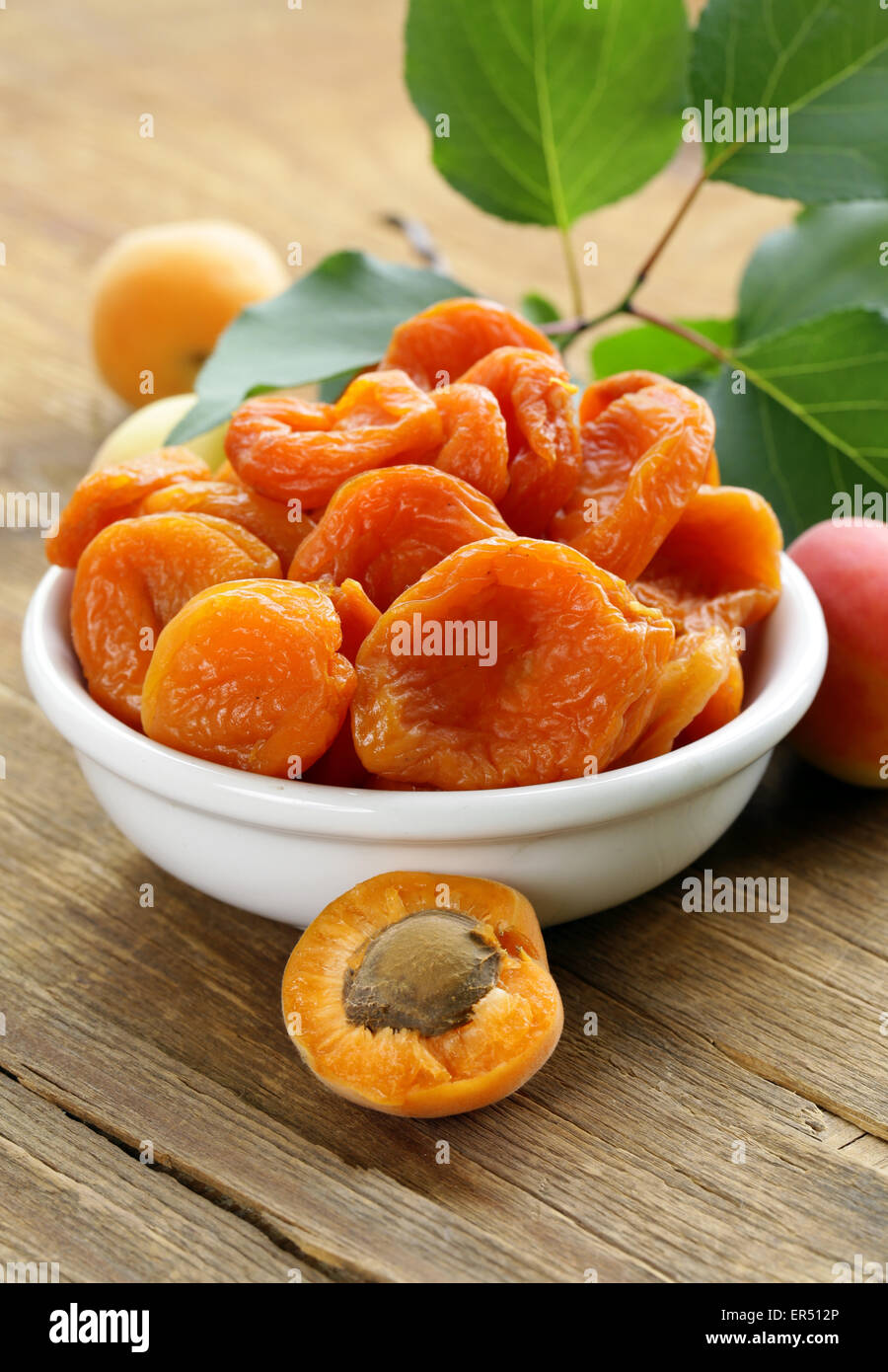 Natural organic dried apricots, rustic still life Stock Photo - Alamy