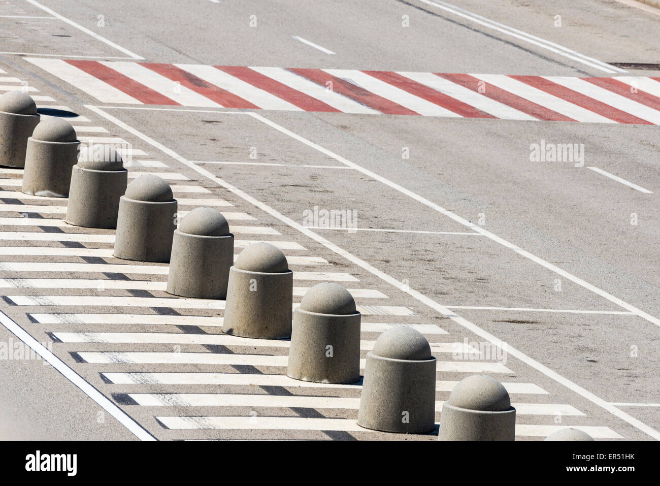 High view of a pedestrian crossing with several bollards Stock Photo ...