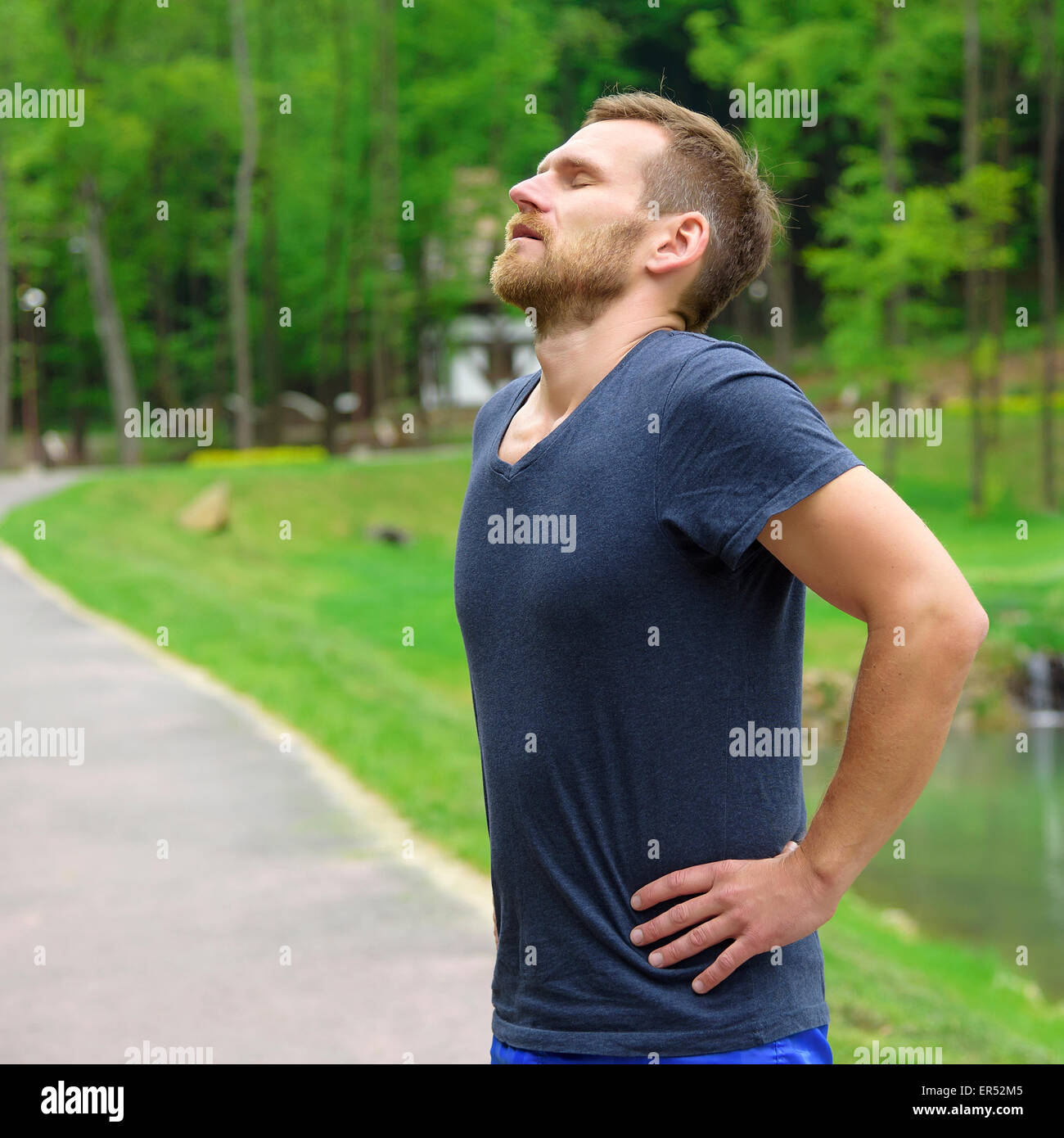 Jogging man taking a break Stock Photo - Alamy Jogging man taking a break Stock Photo - Alamy