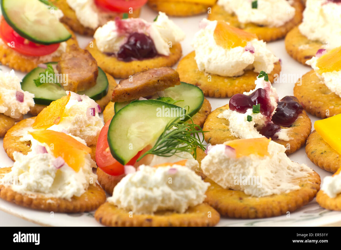 Assorted canopes, appetizer crackers with toppings Stock Photo - Alamy