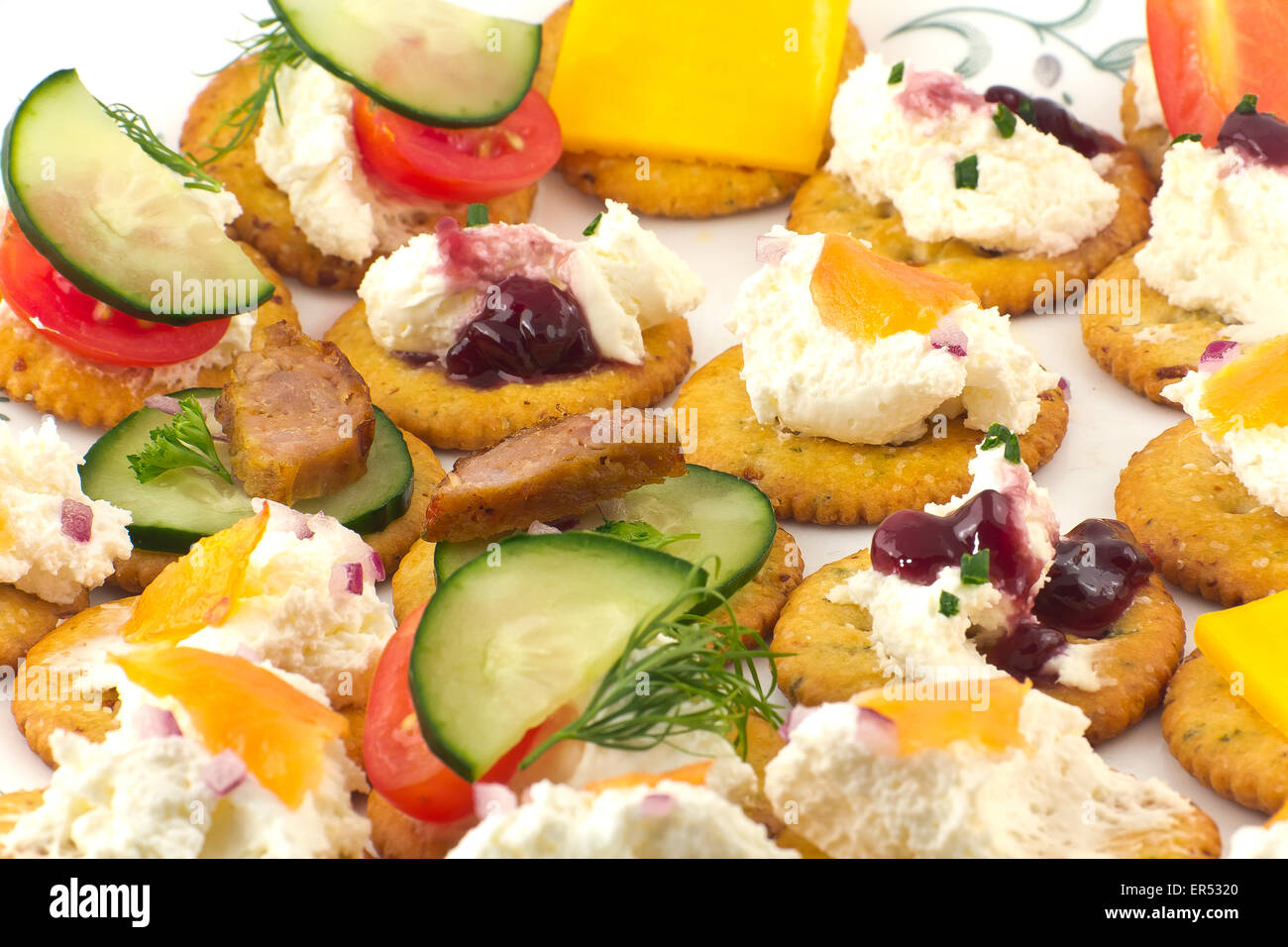 Assorted canopes, appetizer crackers with toppings Stock Photo - Alamy